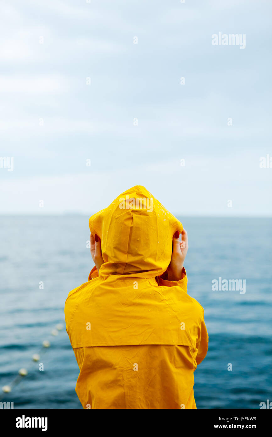 Anonymous girl on waterfront Stock Photo - Alamy