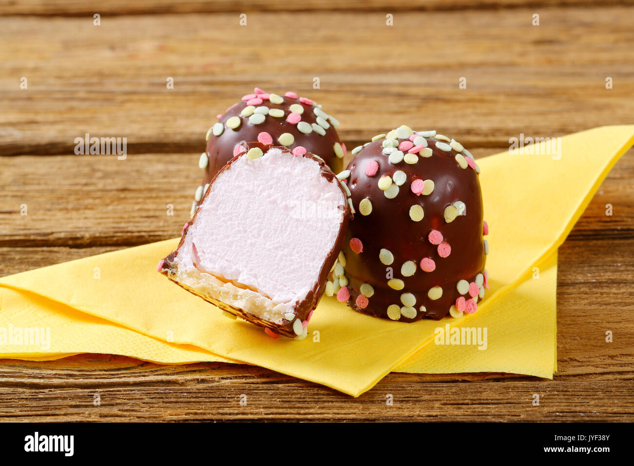 Chocolate-coated marshmallows with confetti sprinkles Stock Photo - Alamy