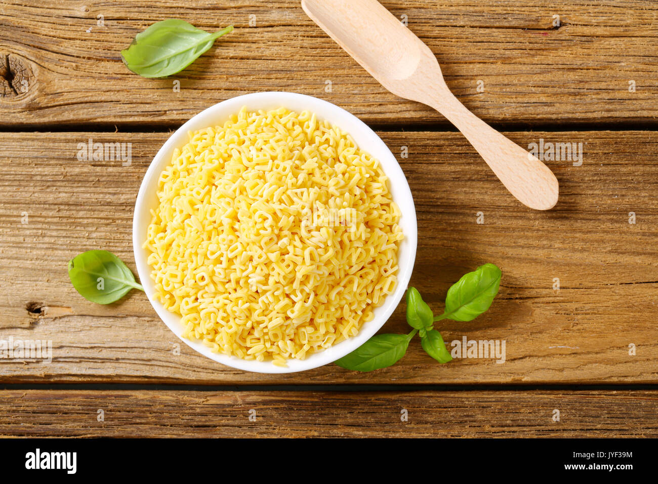 Plate of small letter-shaped pasta Stock Photo - Alamy