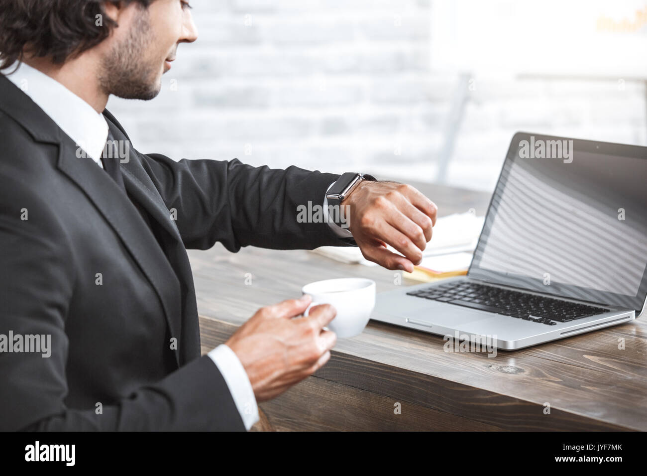 Male person working in the office business checking time Stock Photo ...