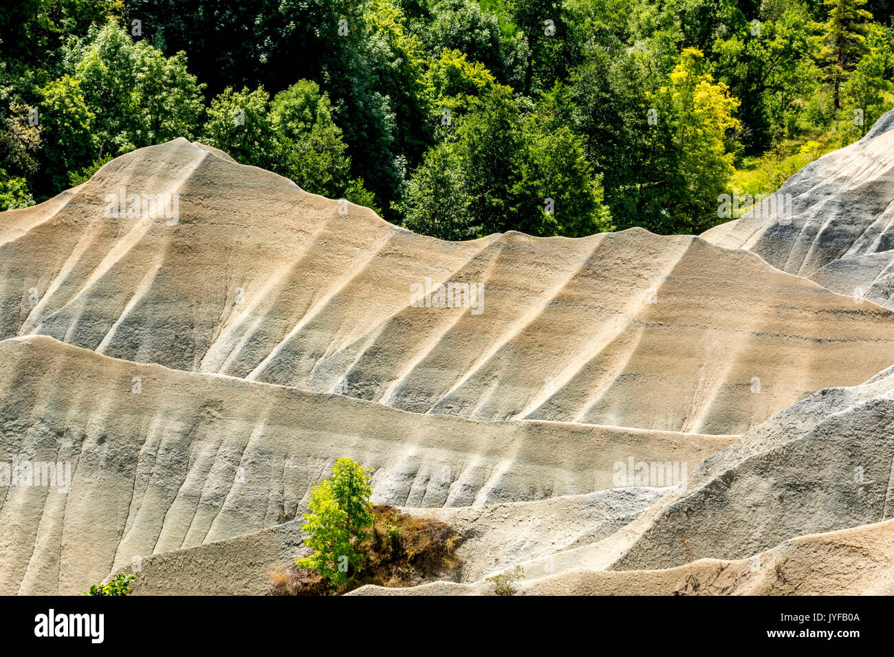 The ravine of Corboeuf, multicolored clay canyon in Rosières village ...