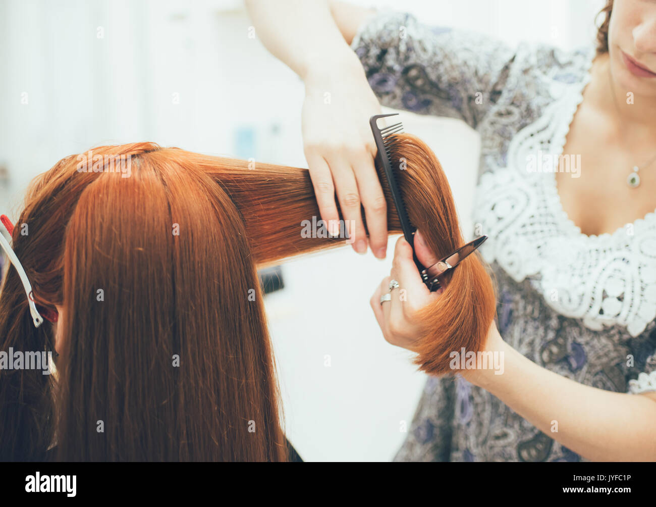 Stylist working in the beauty salon, haircut and hair styling Stock ...