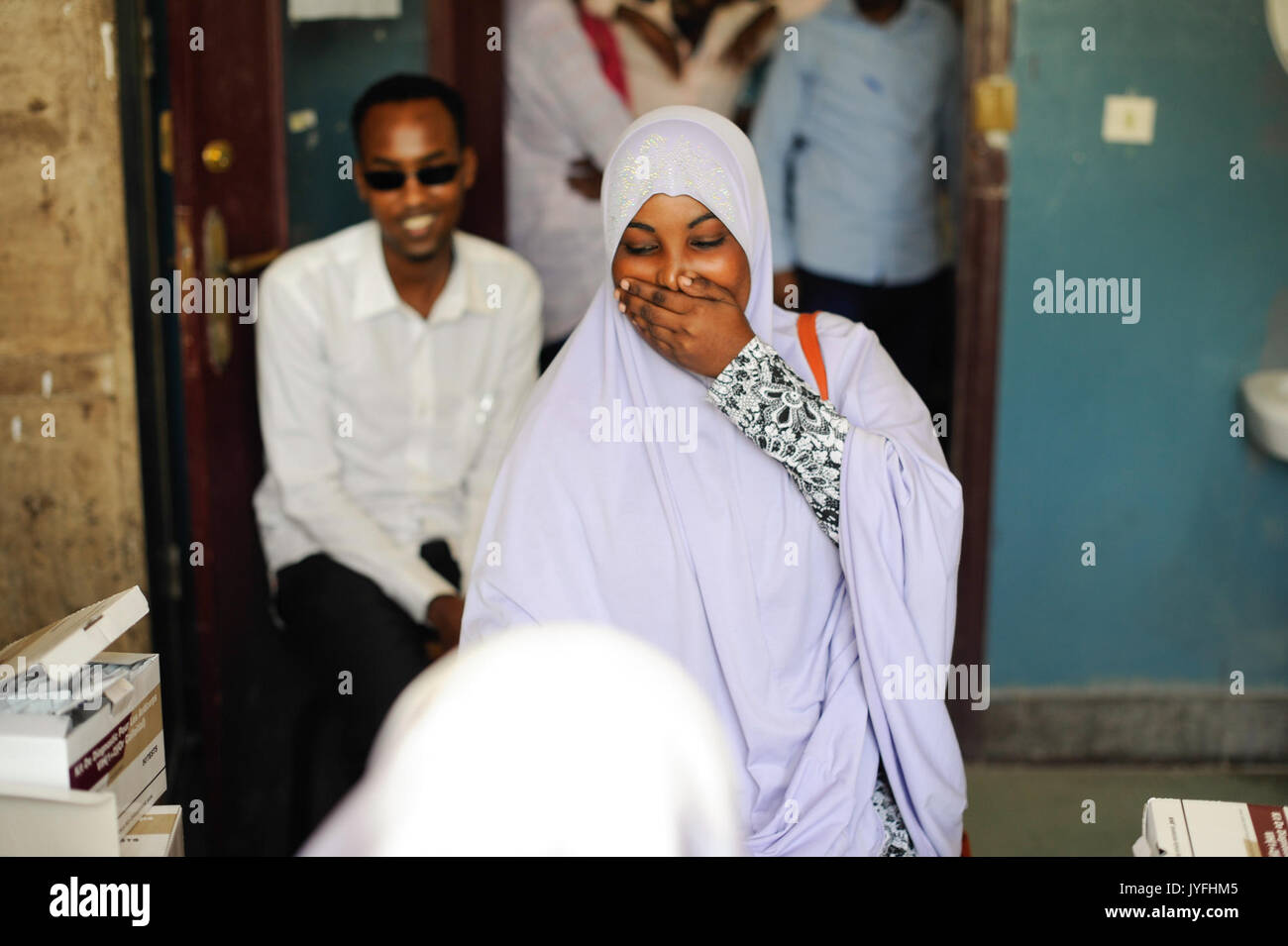 A university student in Mogadishu, Somalia, receives her HIV test ...