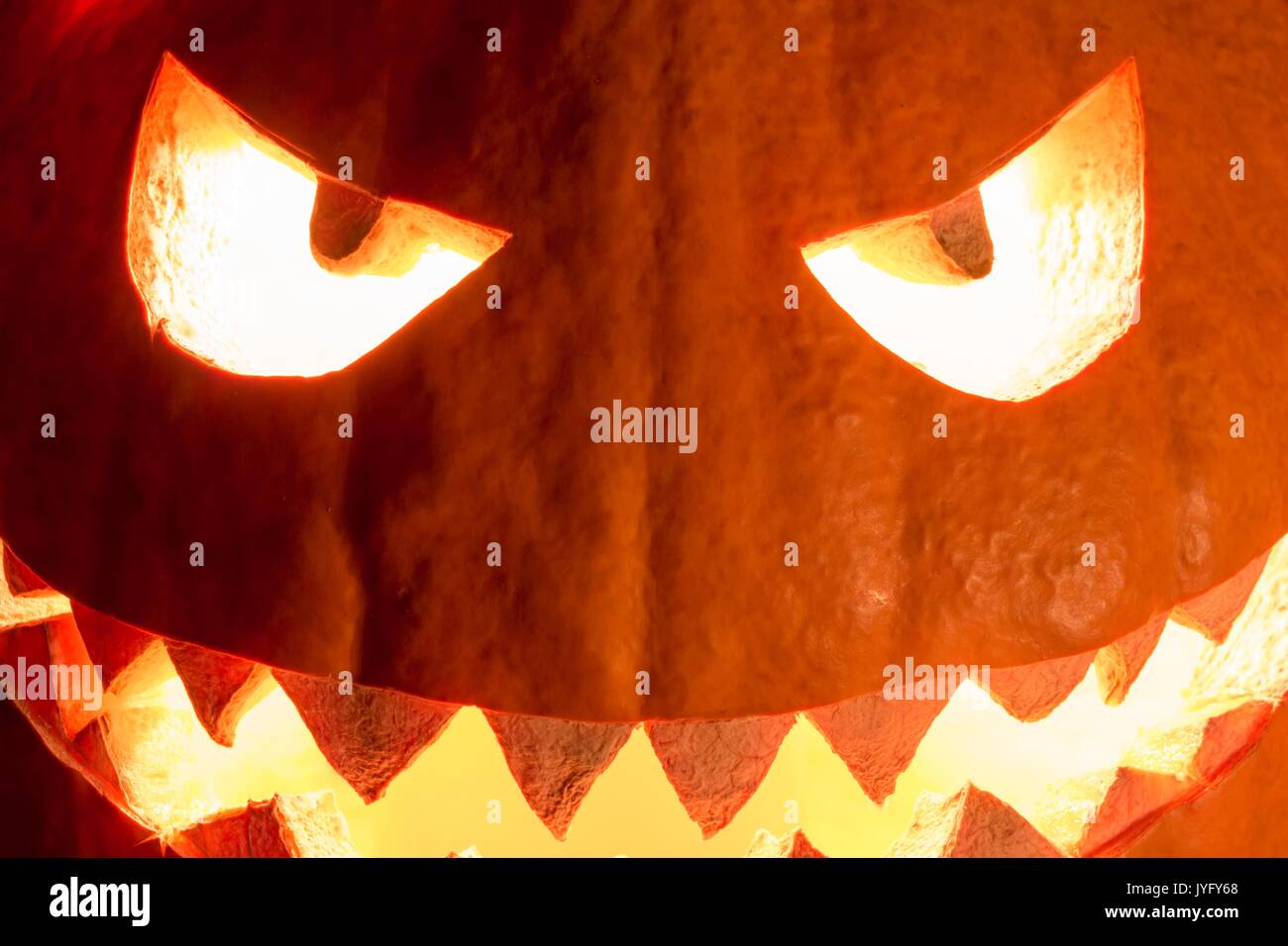 Spooky halloween pumpkin smile with hot burning fire eyes mouth. Big ...