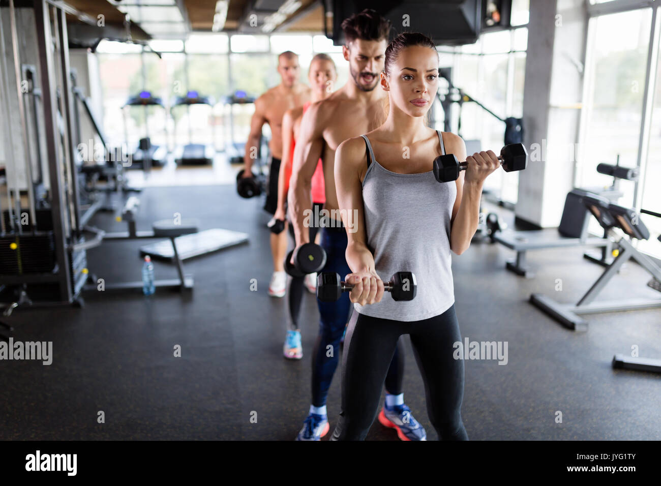 Group of people have workout in gym Stock Photo - Alamy