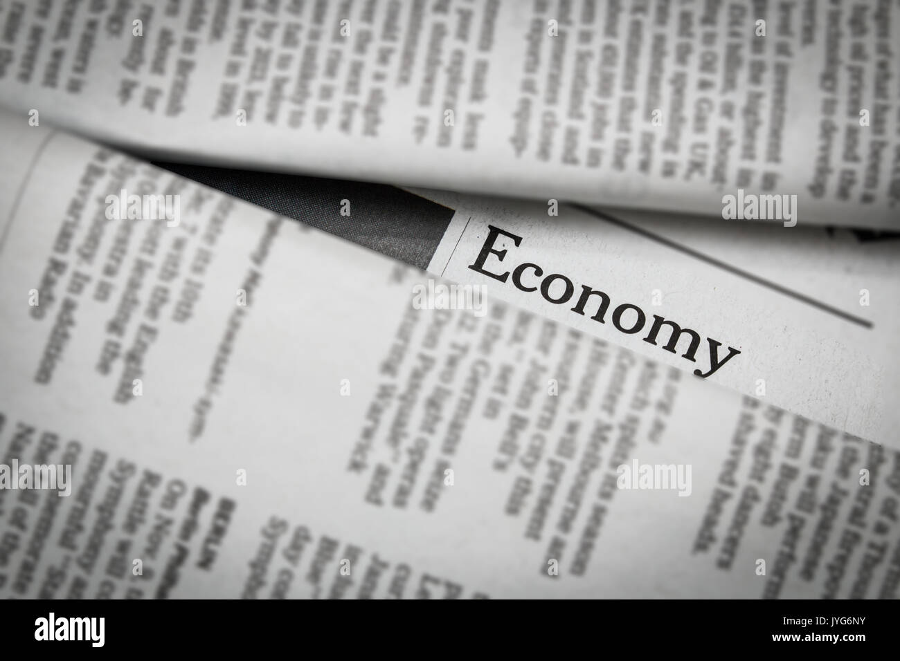 economy issue on newspaper background Stock Photo - Alamy