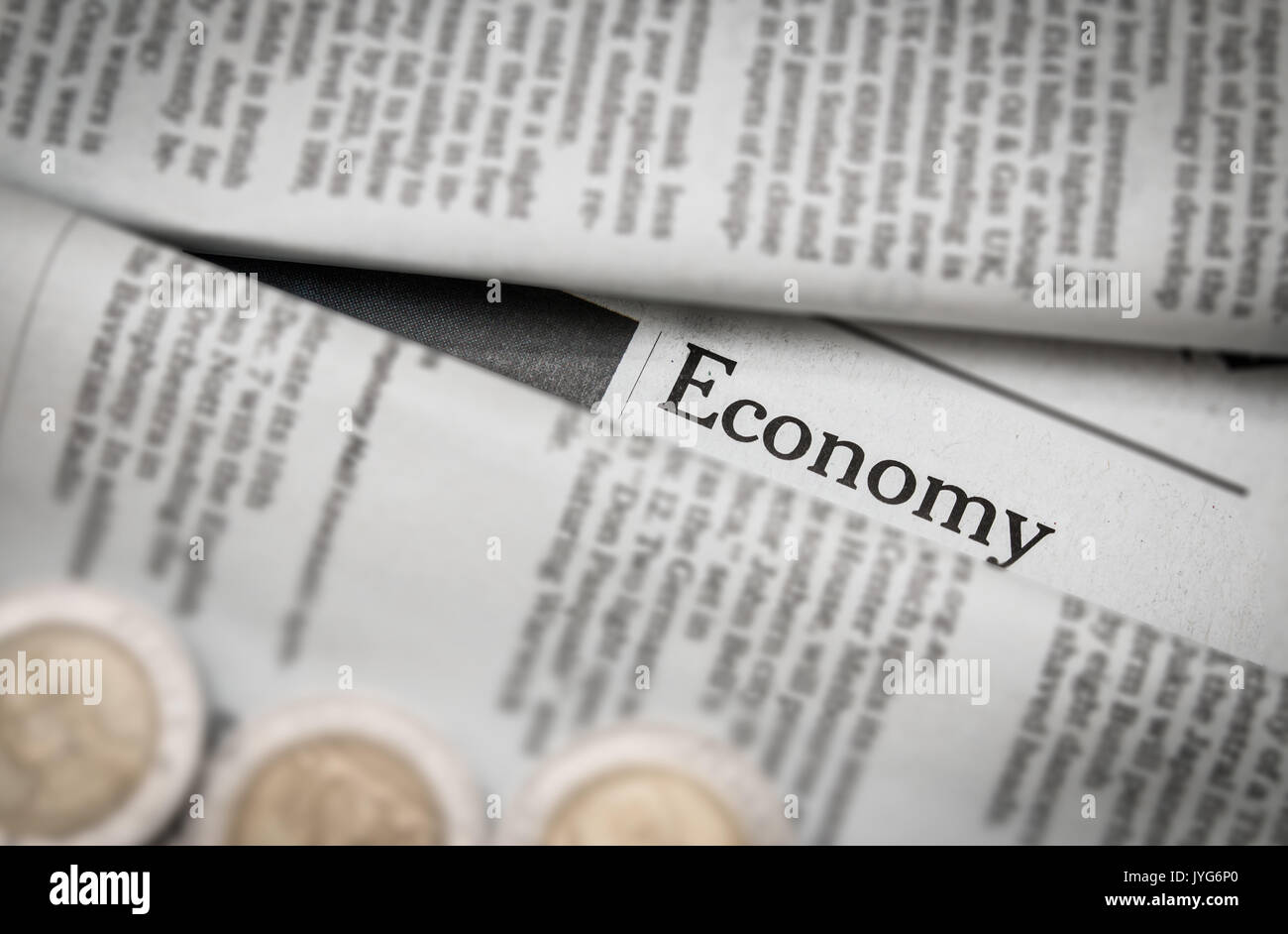 economy issue on newspaper background Stock Photo - Alamy
