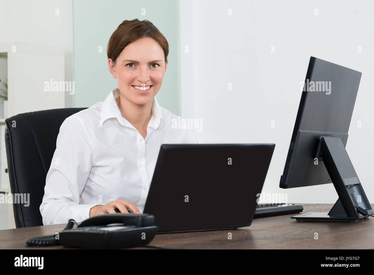Employee working at desk hi-res stock photography and images - Alamy