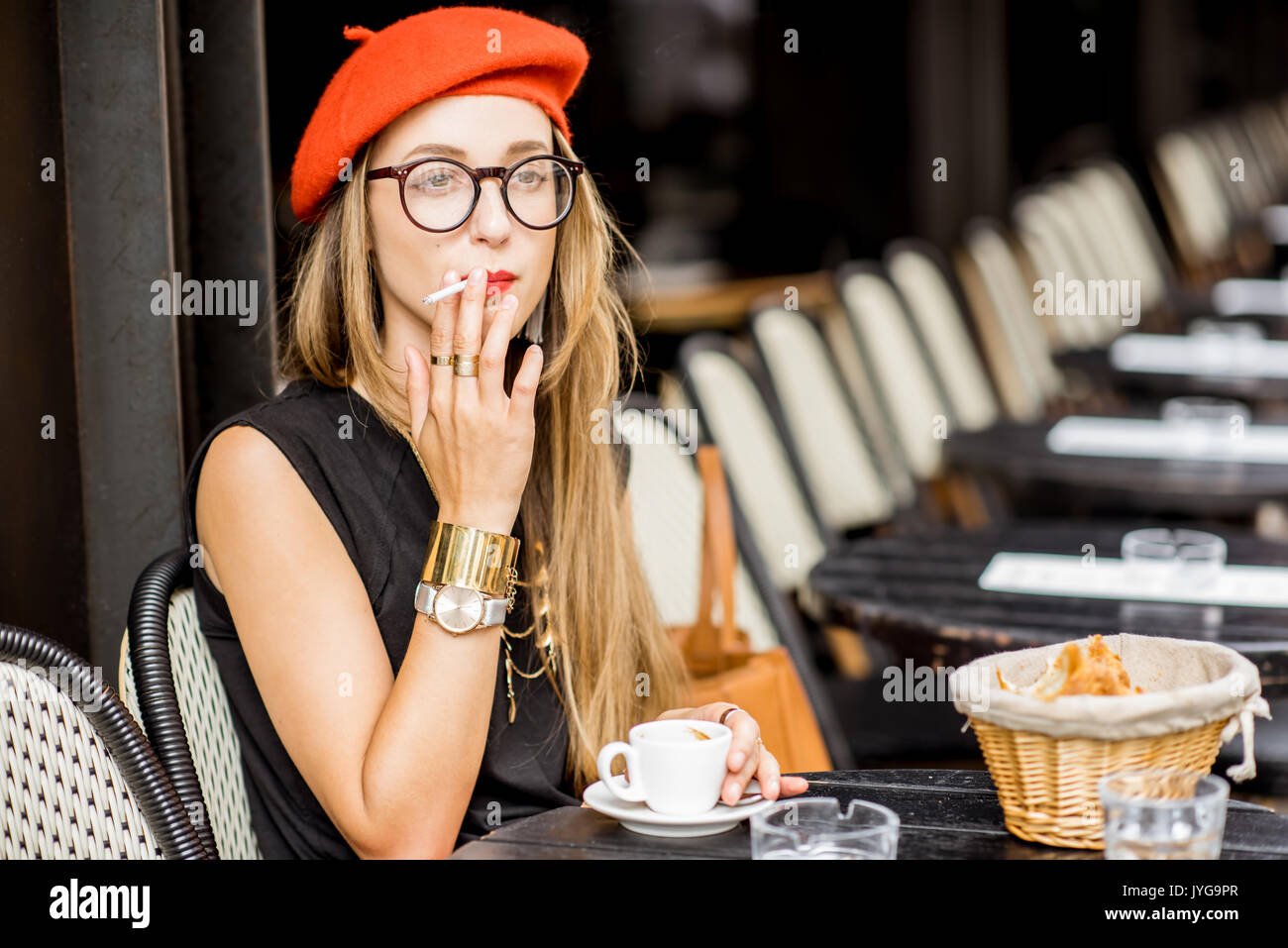 French woman smoking at the cafe Stock Photo - Alamy