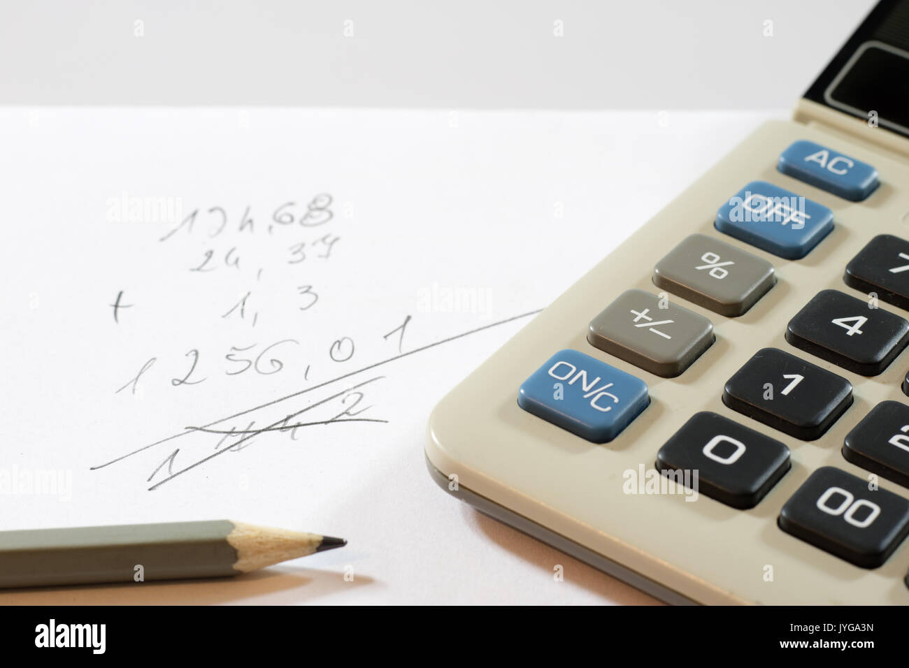 Documents, calculations, calculator, calculator and pen and a pencil on ...
