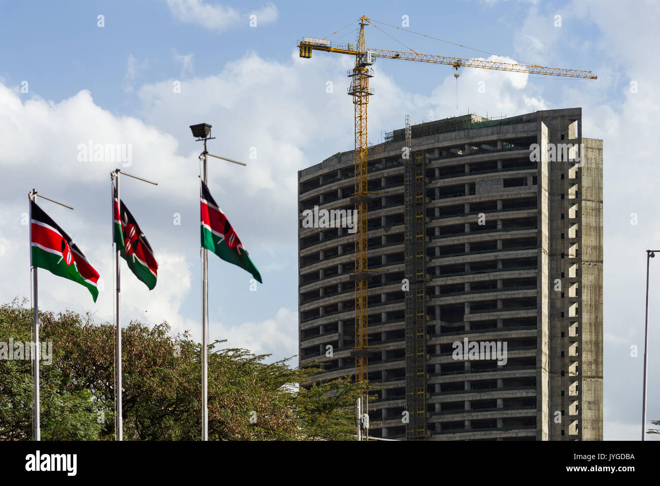 Kenyan flags with parliament tower under construction in background ...