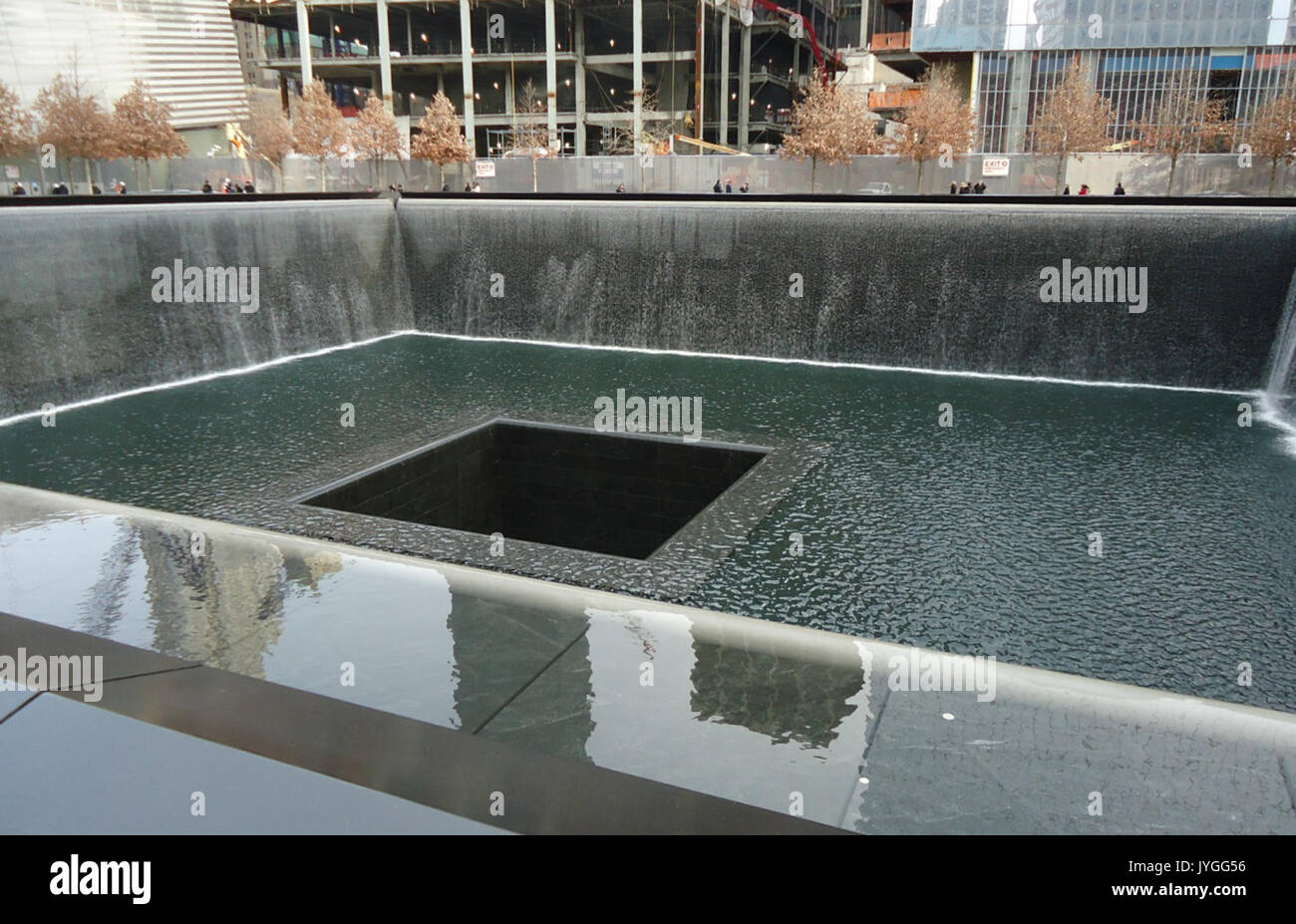 911 Memorial pool with water flowing and people watching Stock Photo ...