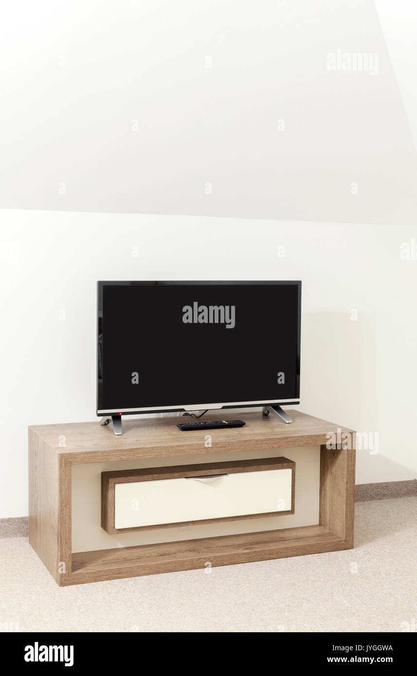 small wooden shelf for the TV , white background Stock Photo - Alamy