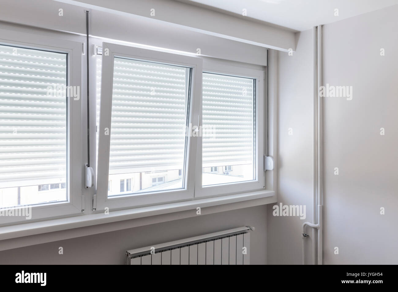 PVC window in white room Stock Photo - Alamy