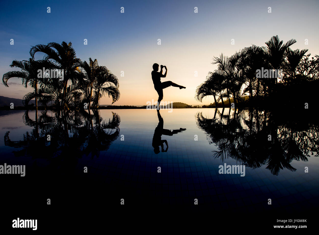 silhouette fighter with twilight sky background Stock Photo - Alamy