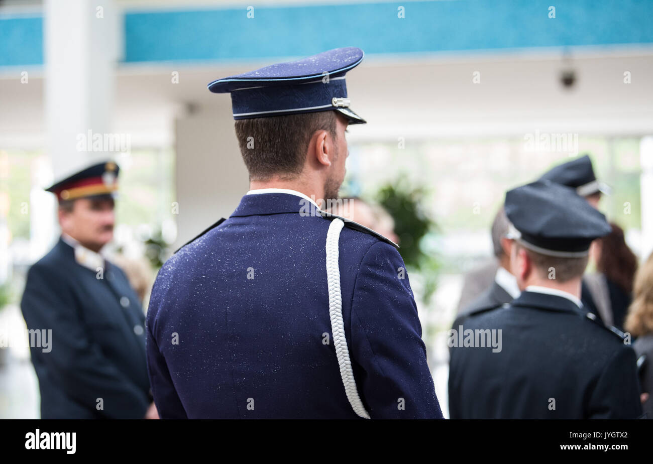 A Romanian police officer (M) takes part in celebrations for the ...