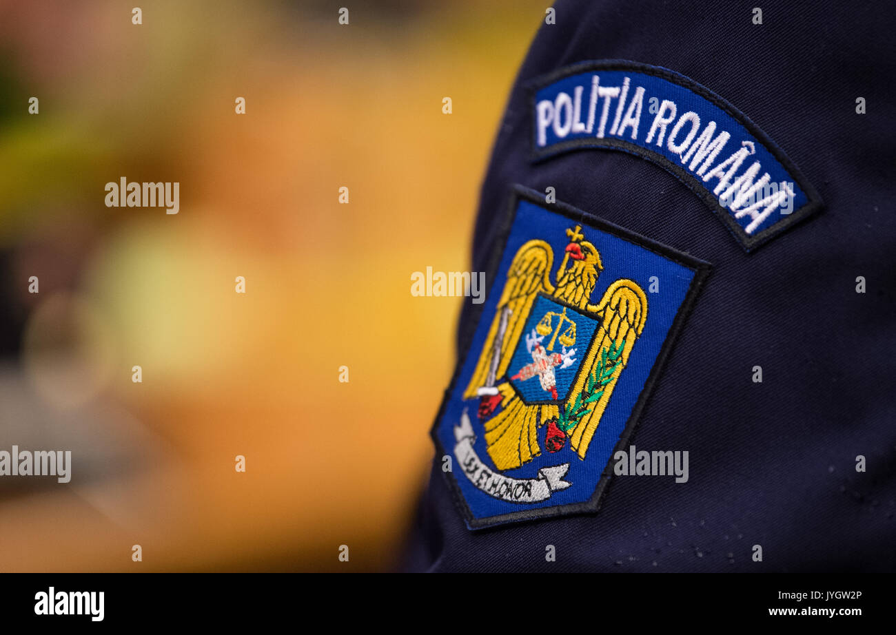 The coat of arms of the Romanian Police on the uniform of a Romanian ...