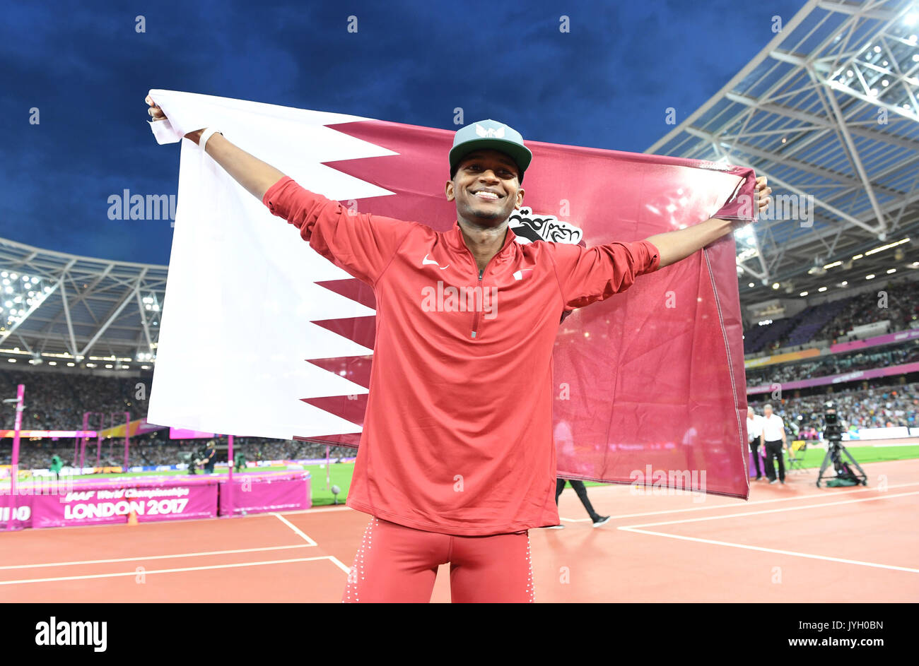 Mutaz Essa Barshim (QAT) poses with Qatar flag after winning the high ...