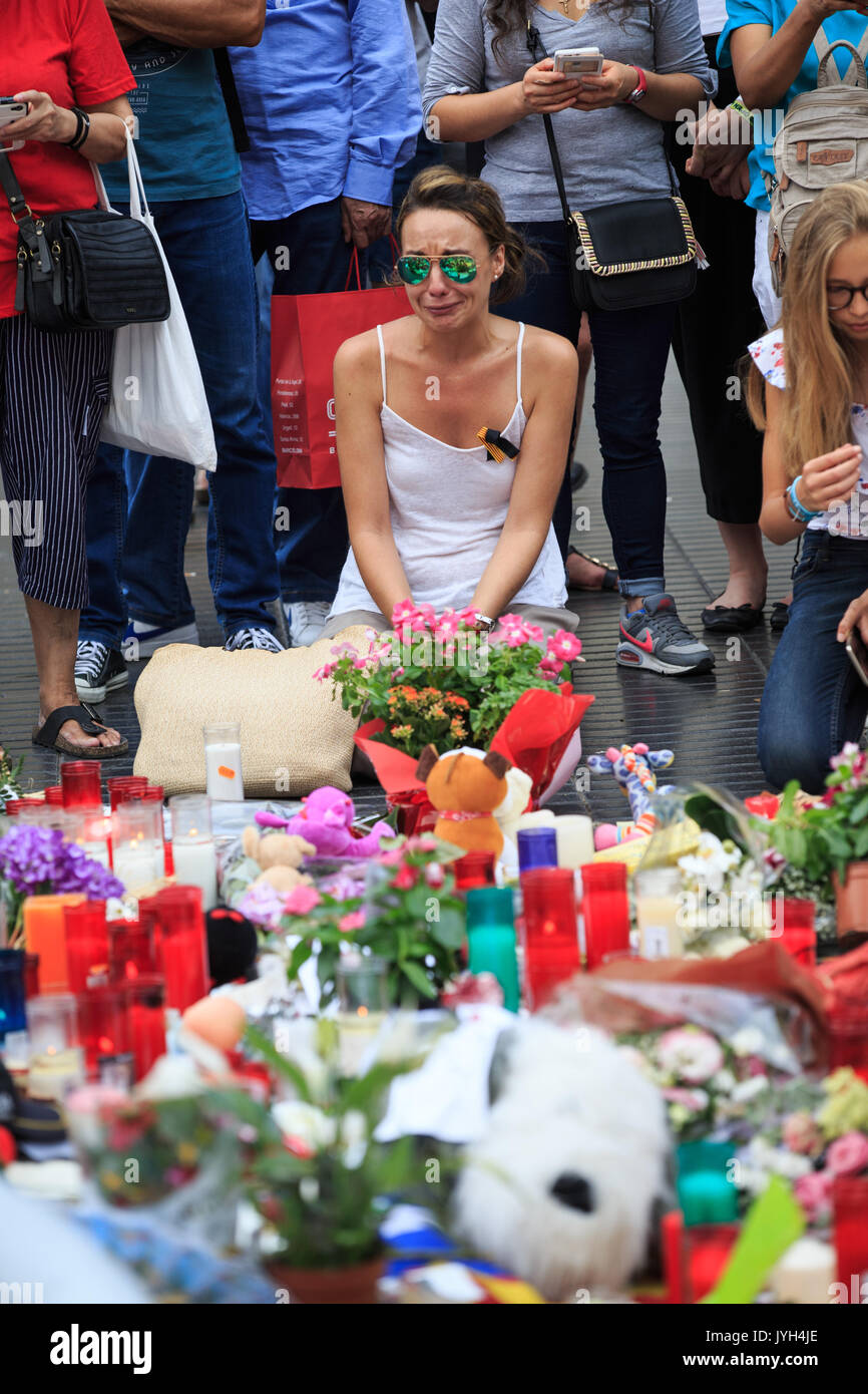 Barcelona, Spain. 19th Aug, 2017. A woman mourns for victims in the ...