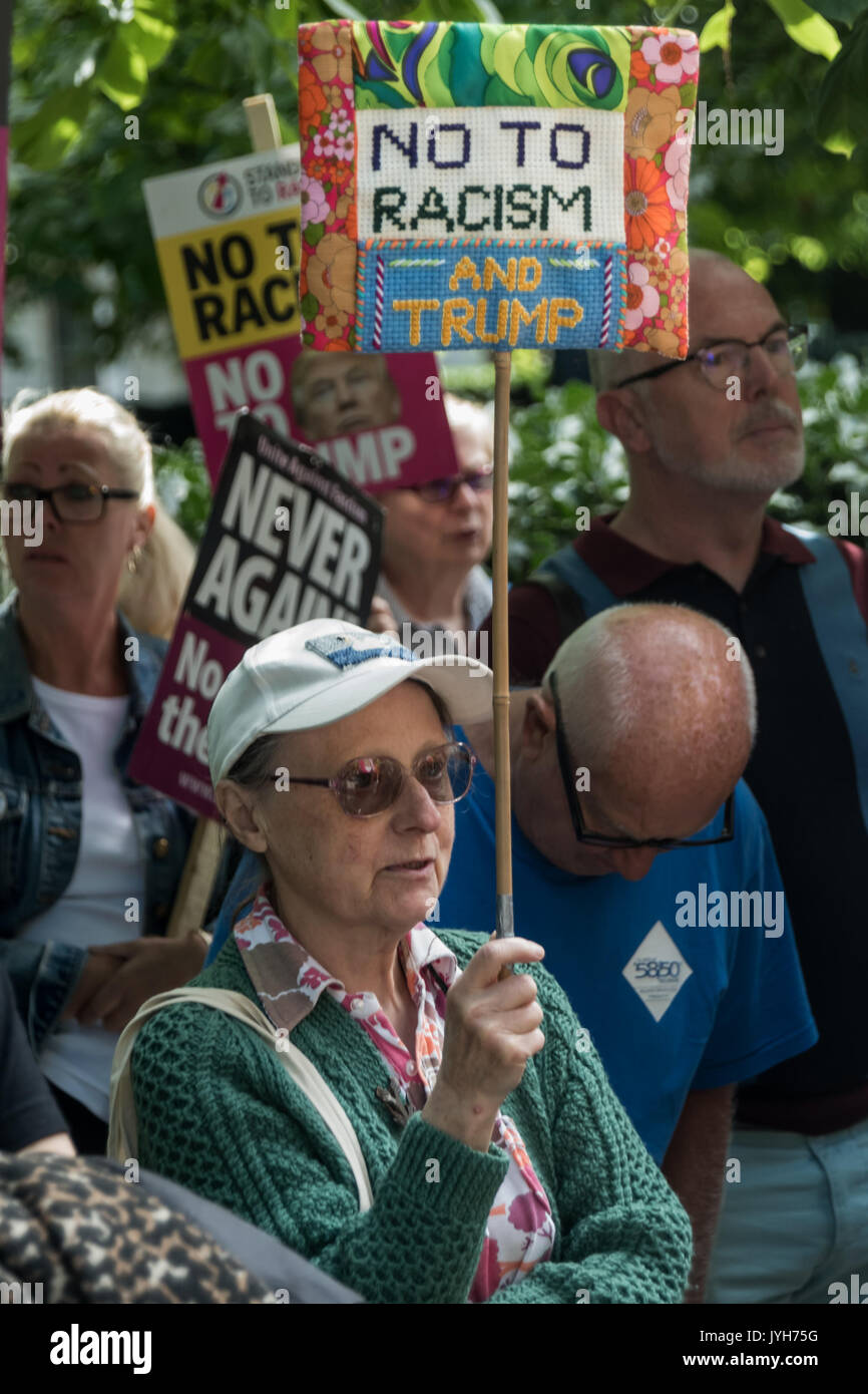 Woman holds against racism hi-res stock photography and images - Alamy