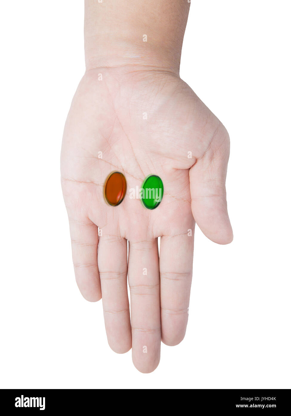 hand holding red and green capsules on white background Stock Photo - Alamy