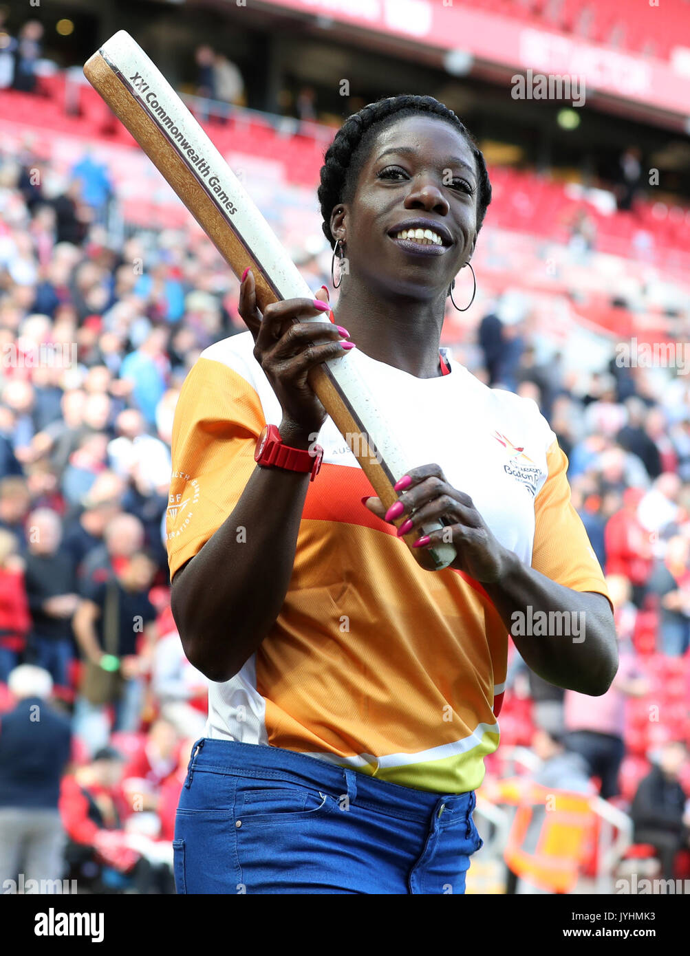Anyika Onuora with the Commonwealth Torch at half time during the ...