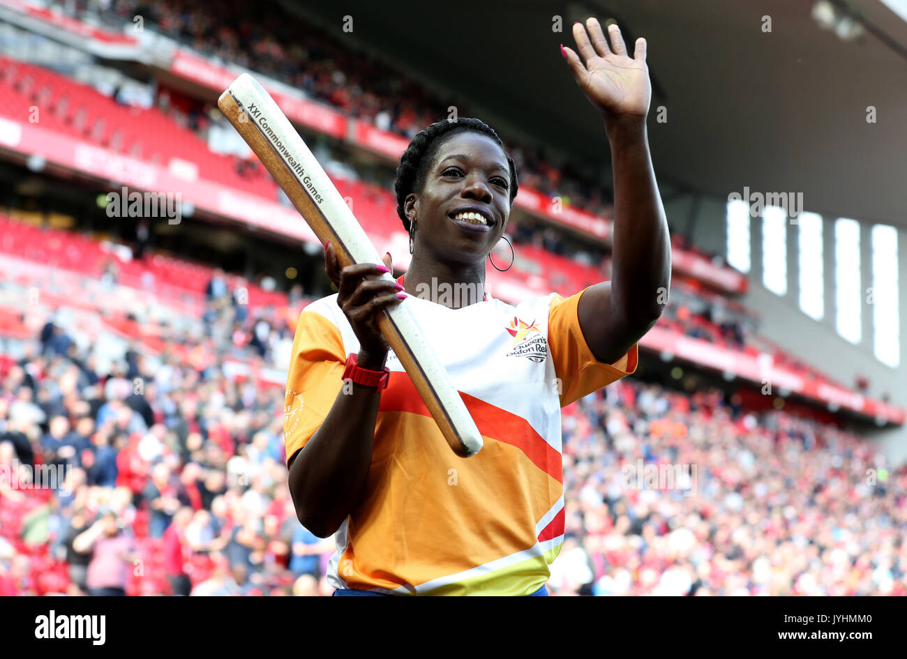 Anyika Onuora with the Commonwealth Torch at half time during the ...