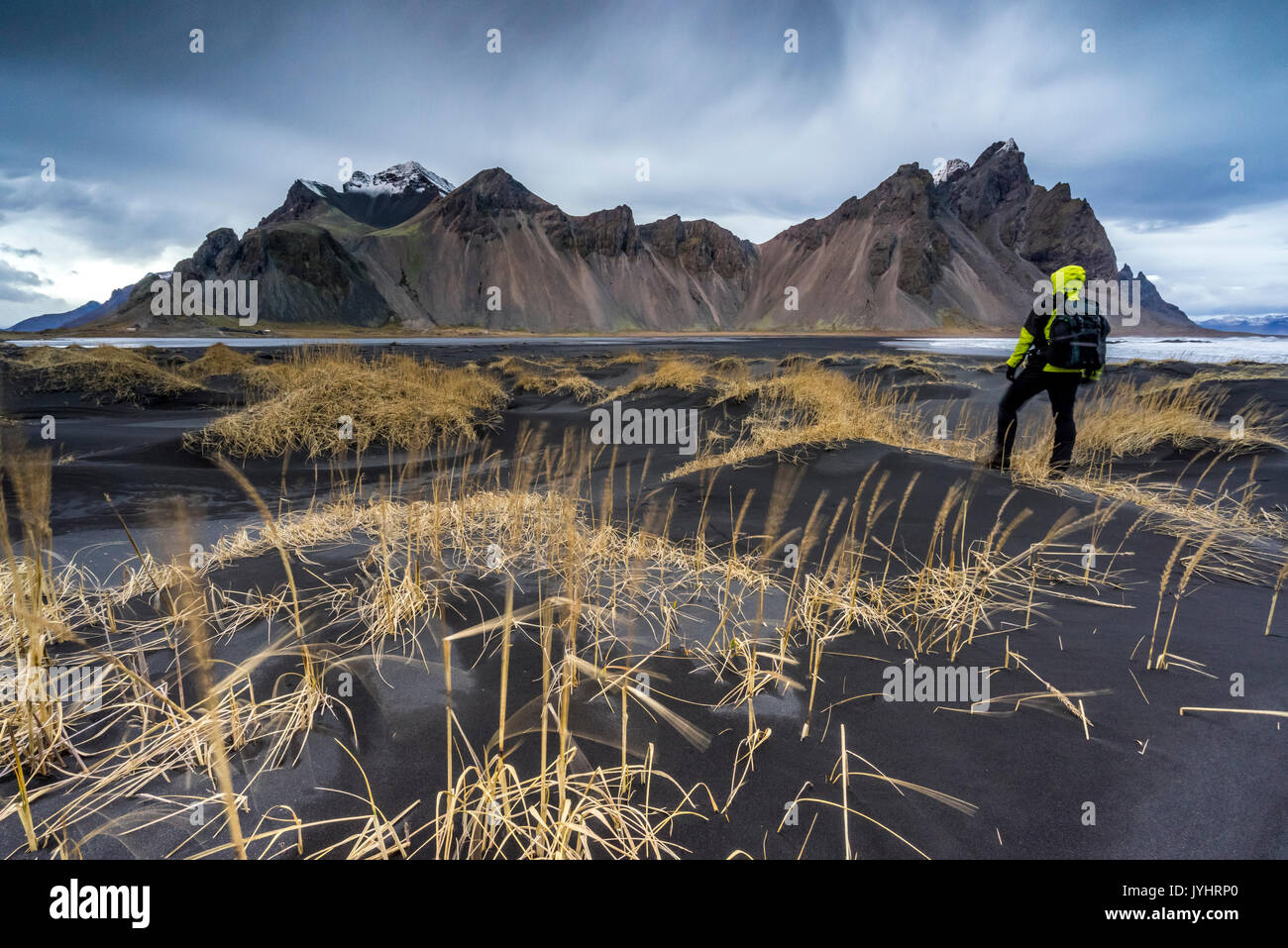 Man overlooking the landscape at Stokksnes, Eastern Iceland, Europe ...