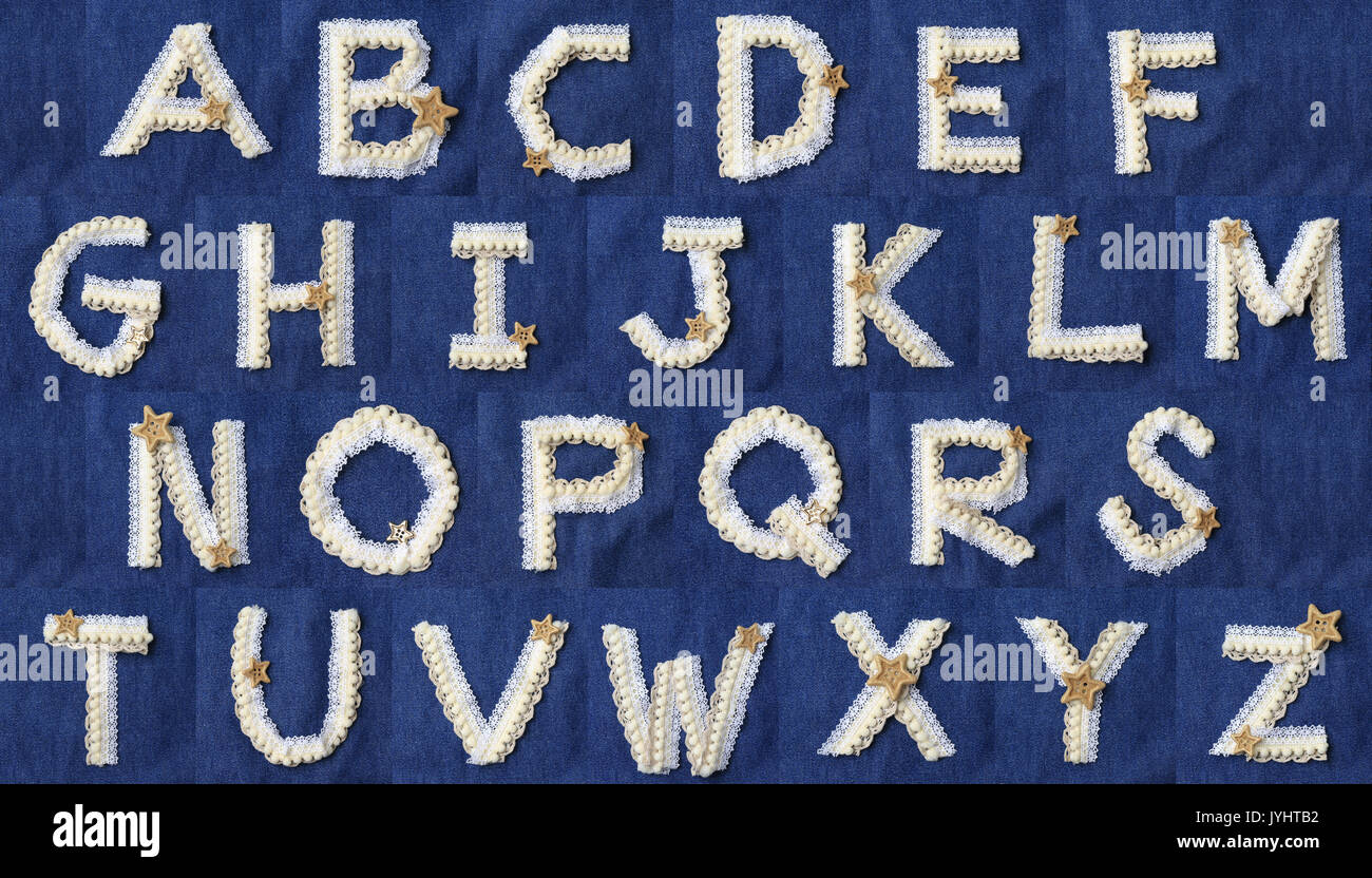 alphabet a to z on blue jeans background Stock Photo - Alamy