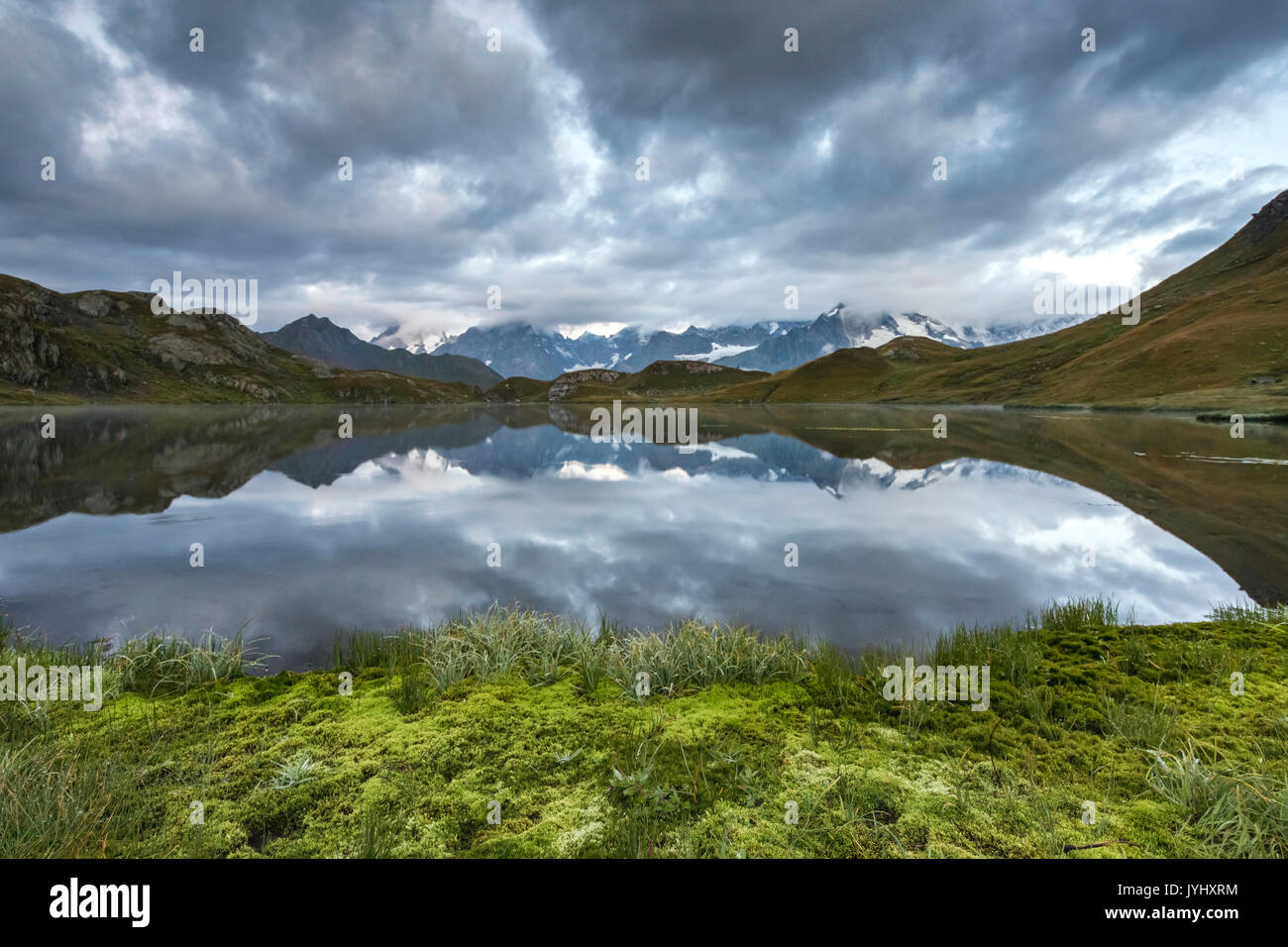 Cloudy sky over Fenetre Lake and the Mont Blanc massif, Ferret valley ...