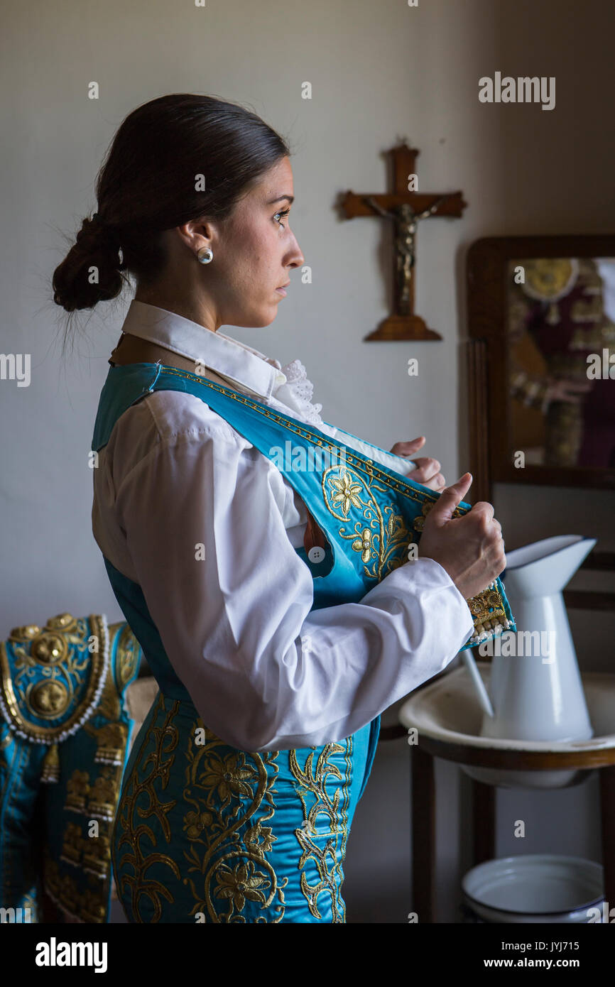 Spanish wife dressed in toreador concentrated before going towards the ...