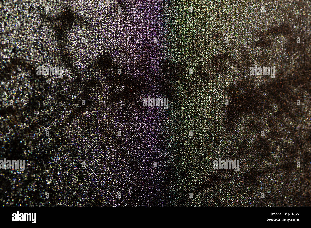 Frosted glass window with street light and silhouetted branches from ...