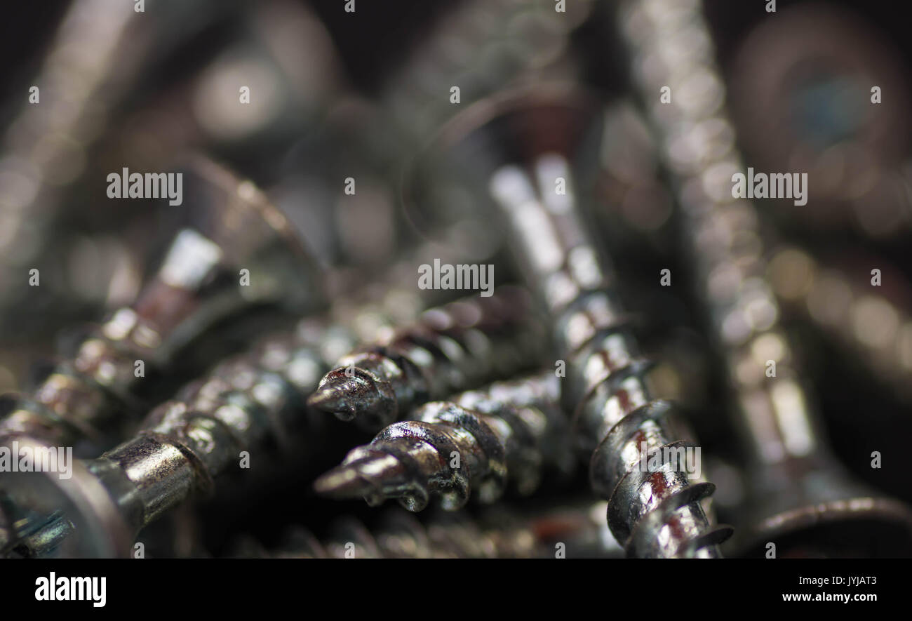 Some screw threads and heads taken in close and the front threads being ...