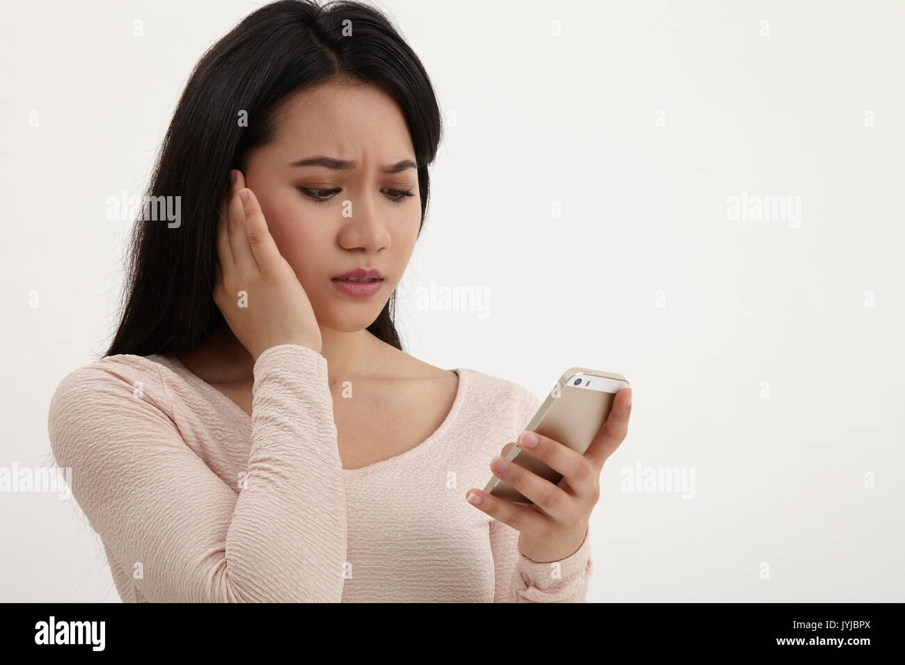 woman feeling sad watching smart phone Stock Photo - Alamy