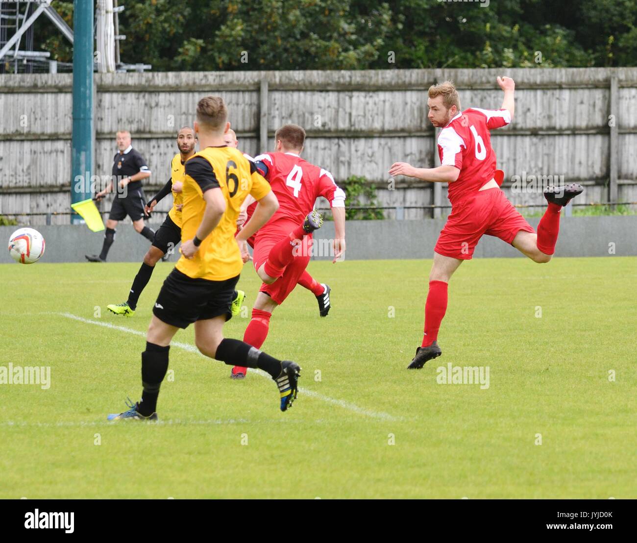 Football action at a non-league match between New Mills and Eccleshall ...