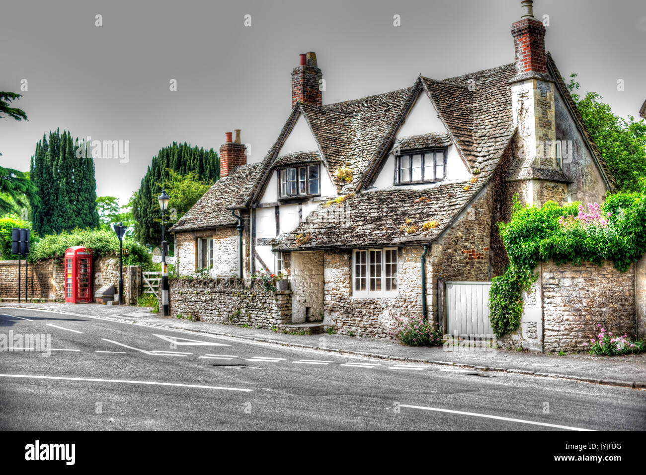 A traditional English roadside cottage at Lacock, Wiltshire, (processed ...
