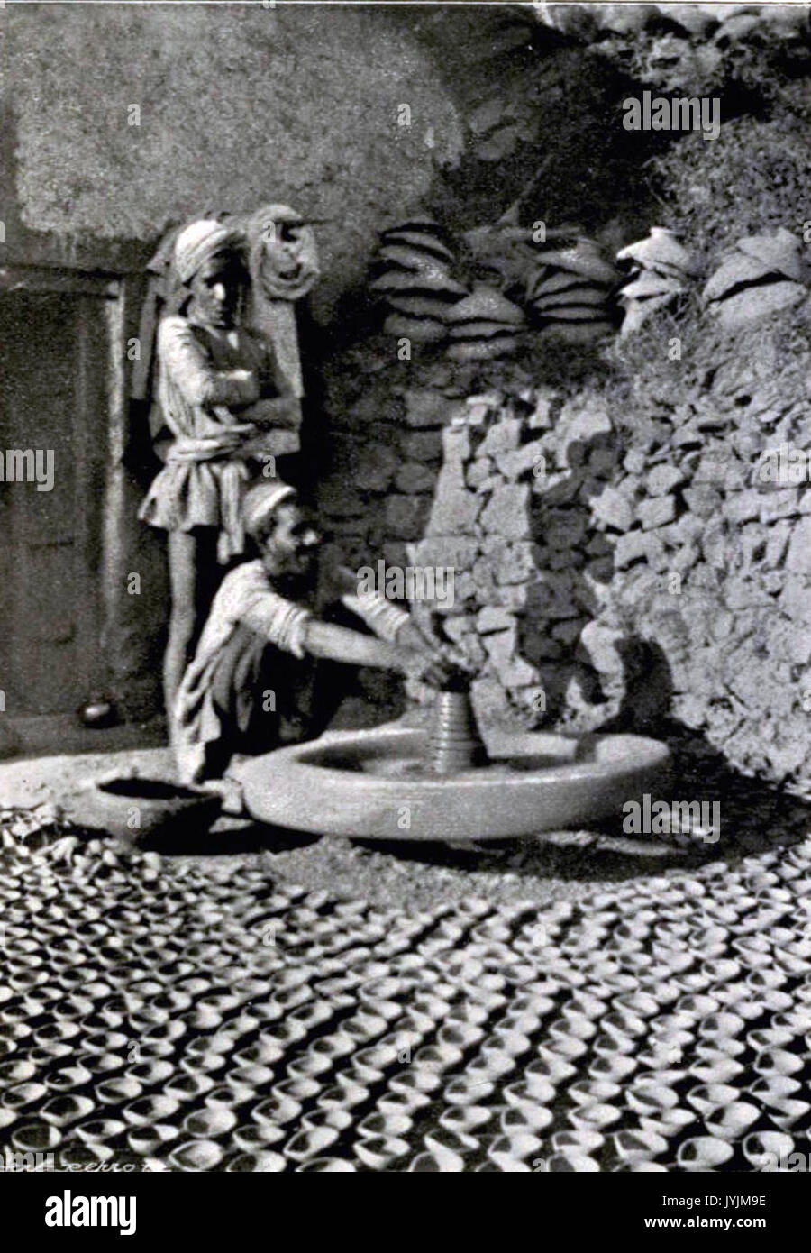 A potter and his apprentice Stock Photo - Alamy