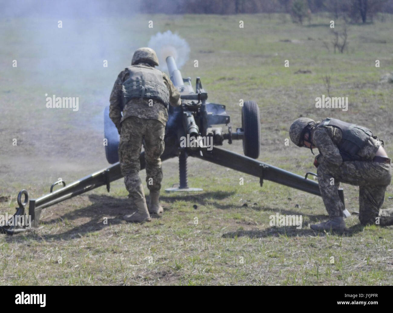 A soldier with the Ukrainian Land Forces fires an 82mm mortar Stock ...