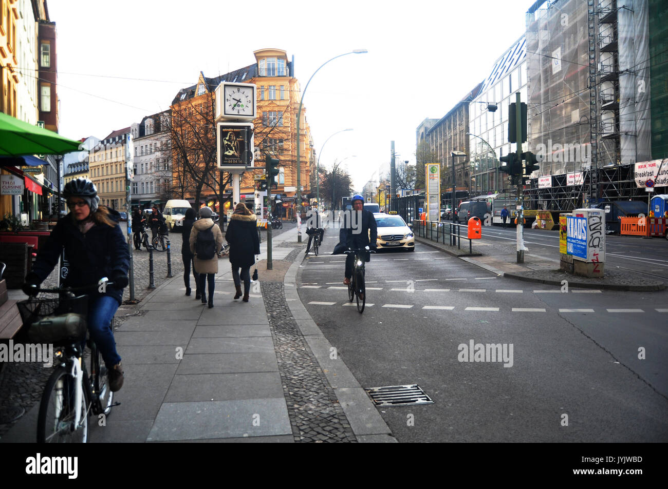 View cityscape of German people walking on the footpath and biking ...