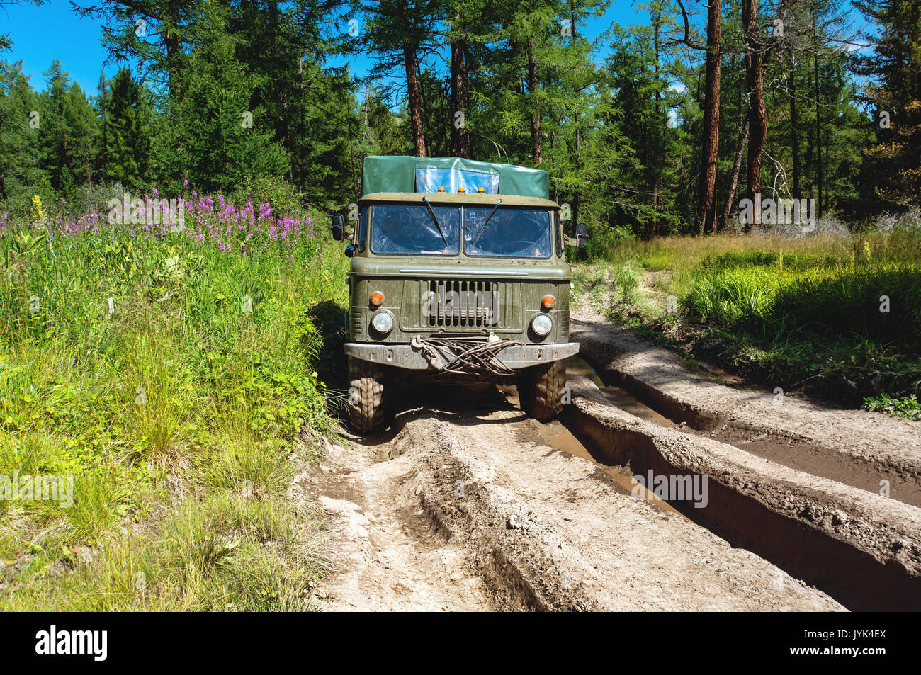 Heavy powerful truck-terrain vehicle with off-road wheels to overcome ...
