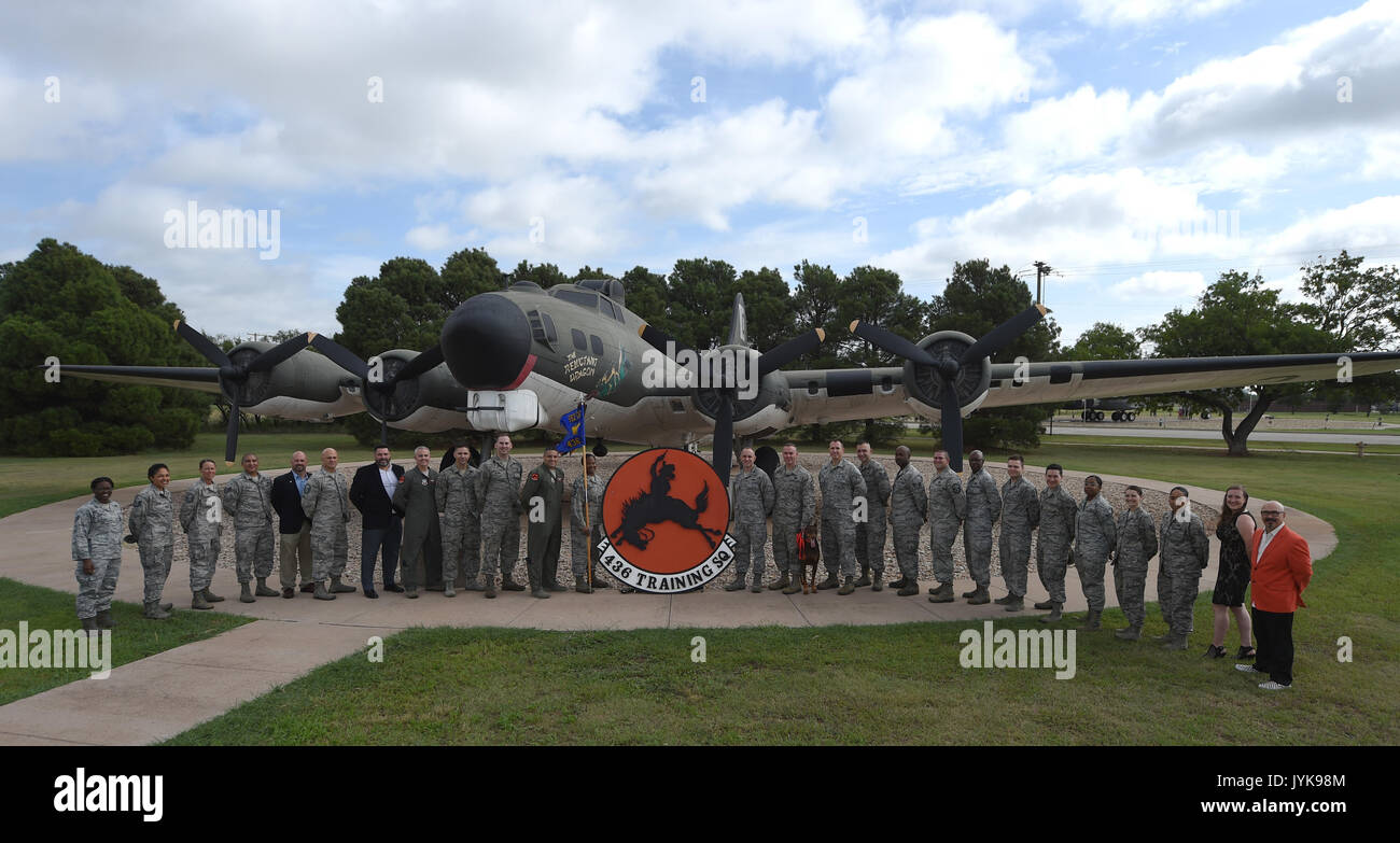 The 436th Training Squadron displays their unit patch in front of a B24 ...