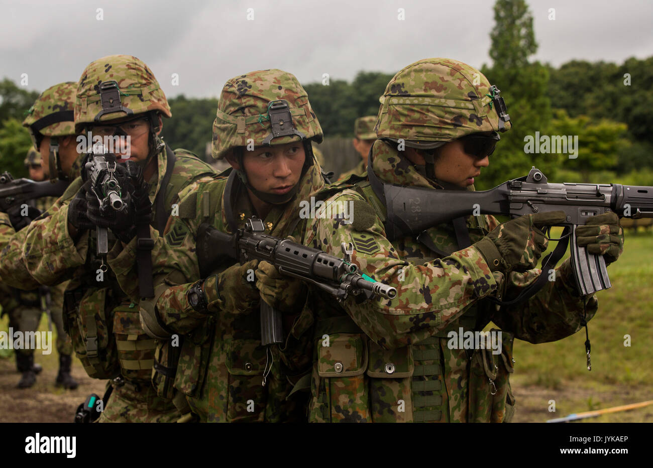 Japan Ground Self-Defense Force soldiers prepare to enter a building ...