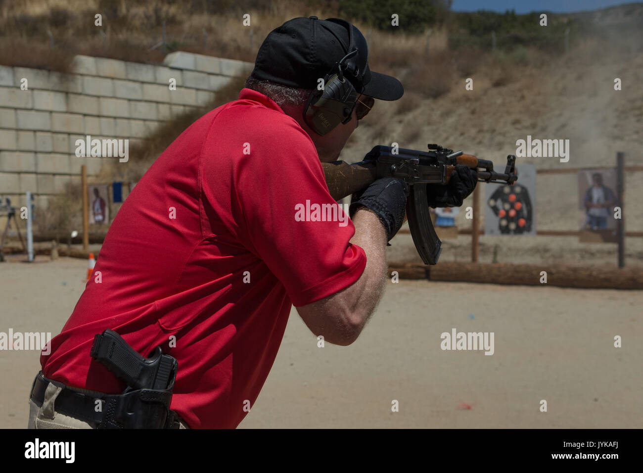 An Alcohol, Tobacco, and Firearms (ATF) Instructor shoots a Thompson ...