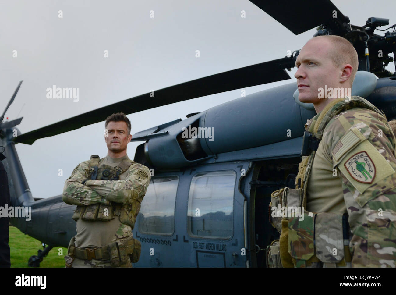 A 56th Rescue Squadron HH-60G Pavehawk helicopter pilot, right ...