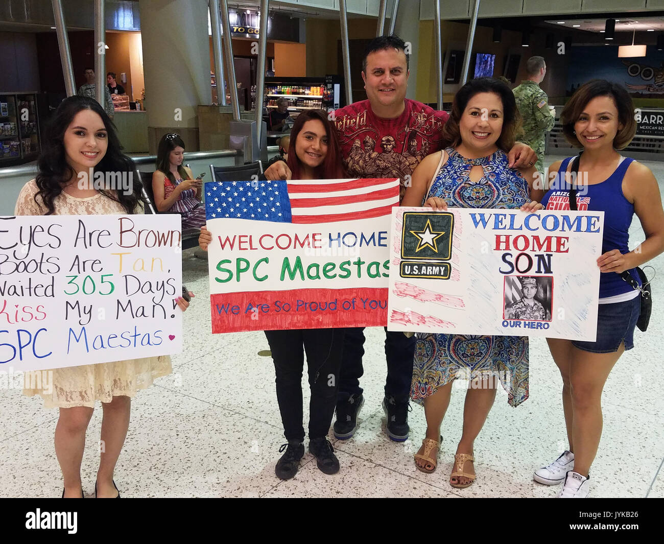The Maestas family waits for Spc. Gary Maestas upon the 159th Finance ...