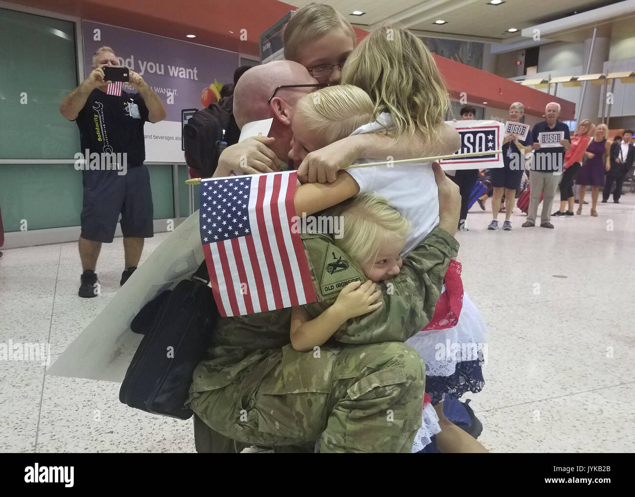 Family members greet Staff Sgt. David McKane upon the 159th Finance ...
