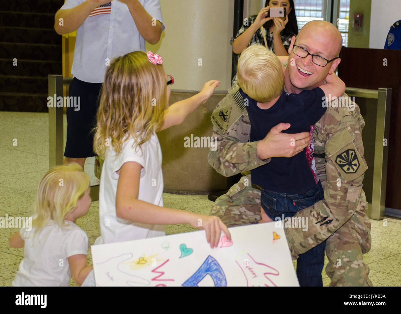 Family members greet Staff Sgt. David McKane upon the 159th Finance ...