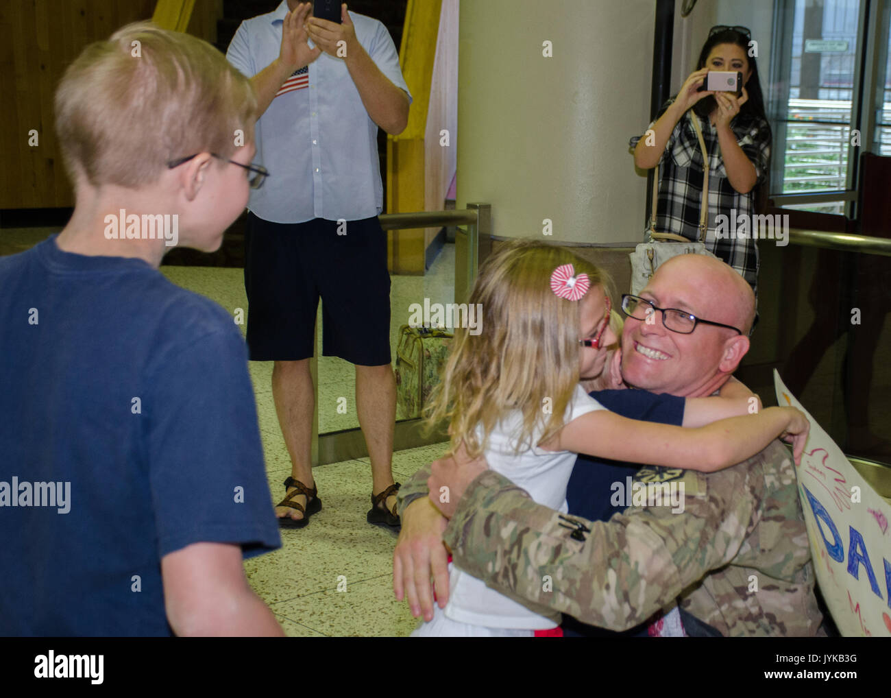 Family members greet Staff Sgt. David McKane upon the 159th Finance ...