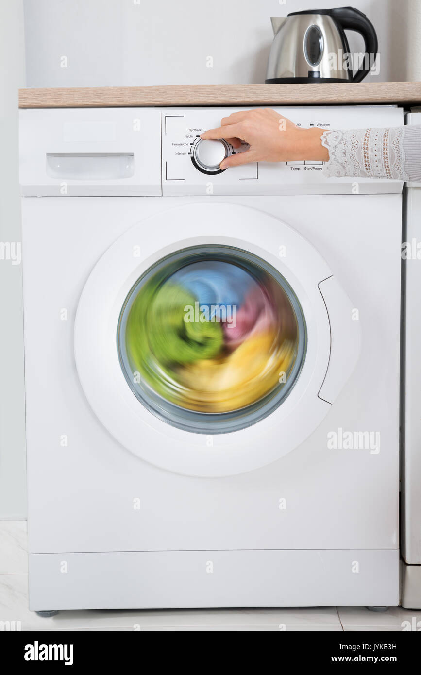 Woman washing clothes by hand hi-res stock photography and images - Alamy