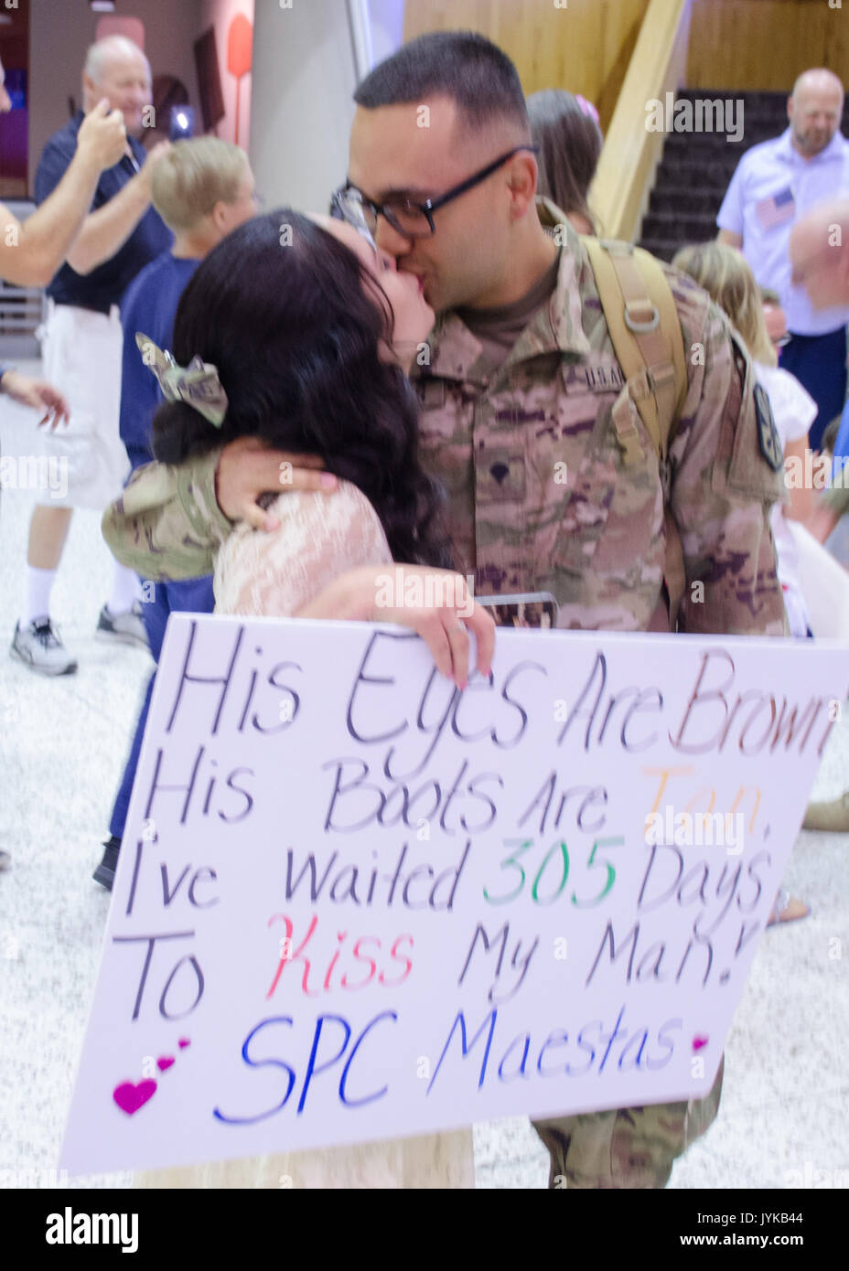 Spc. Gary Maestas is greeted with a kiss from his wife upon the 159th ...
